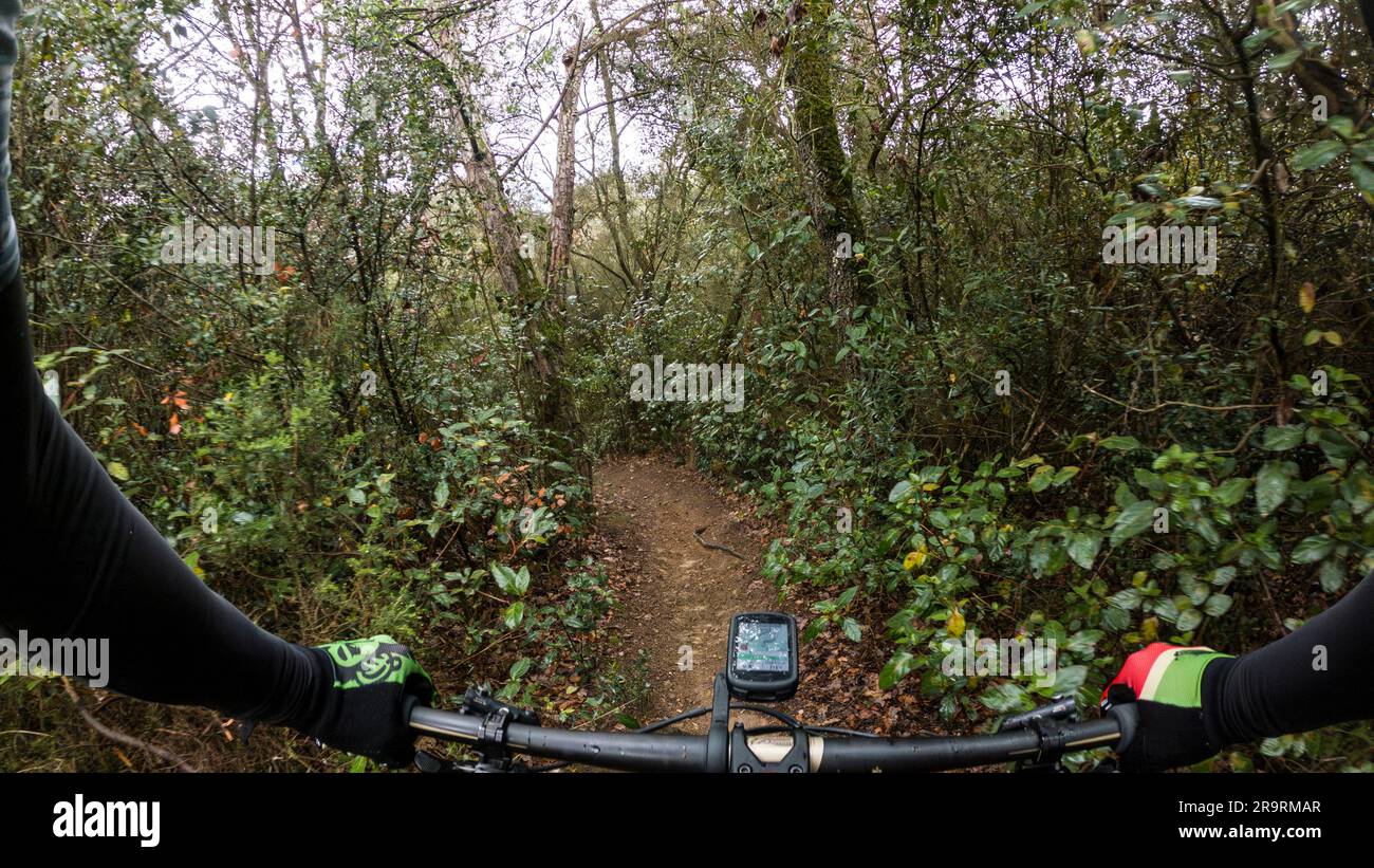 Riding a mountain bike from rider point of view on the handlebar on a ...