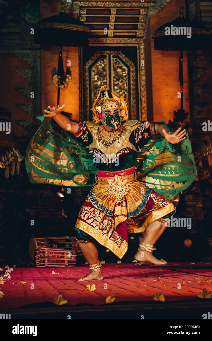 Unrecognisable Balinese artist dancing with show mask. Traditional bali ...