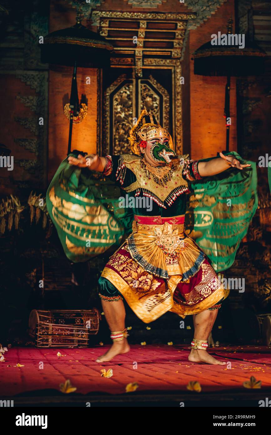 Unrecognisable Balinese artist dancing with show mask. Traditional bali ...