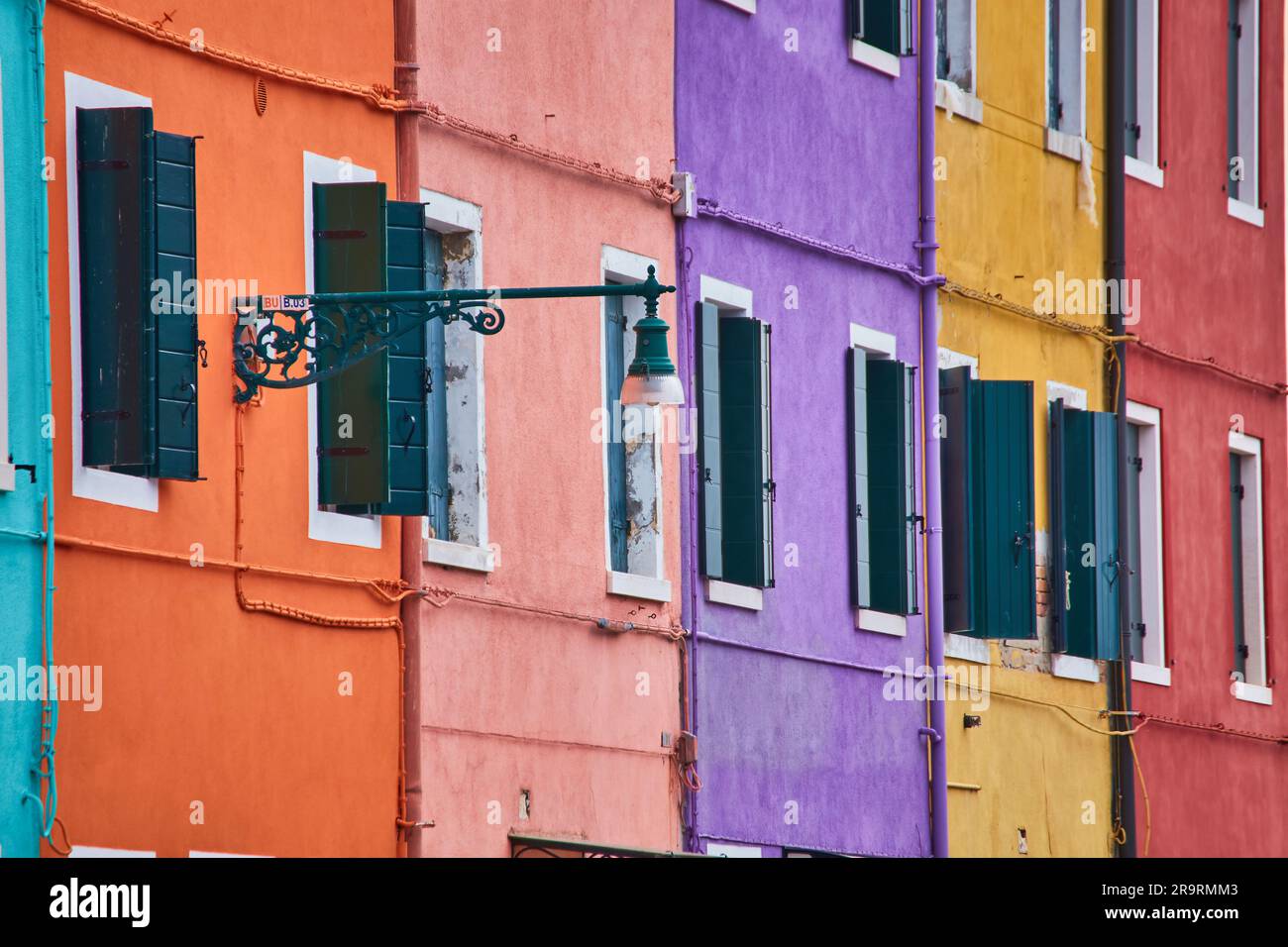 Colorful houses on the canal in Burano island, Venice, Italy. Famous ...