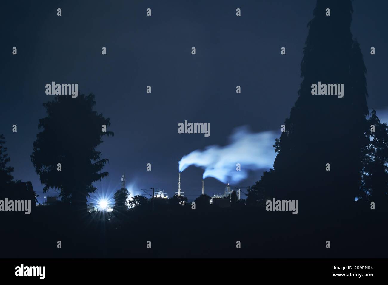 Silhouette of a sugar factory at night Stock Photo - Alamy
