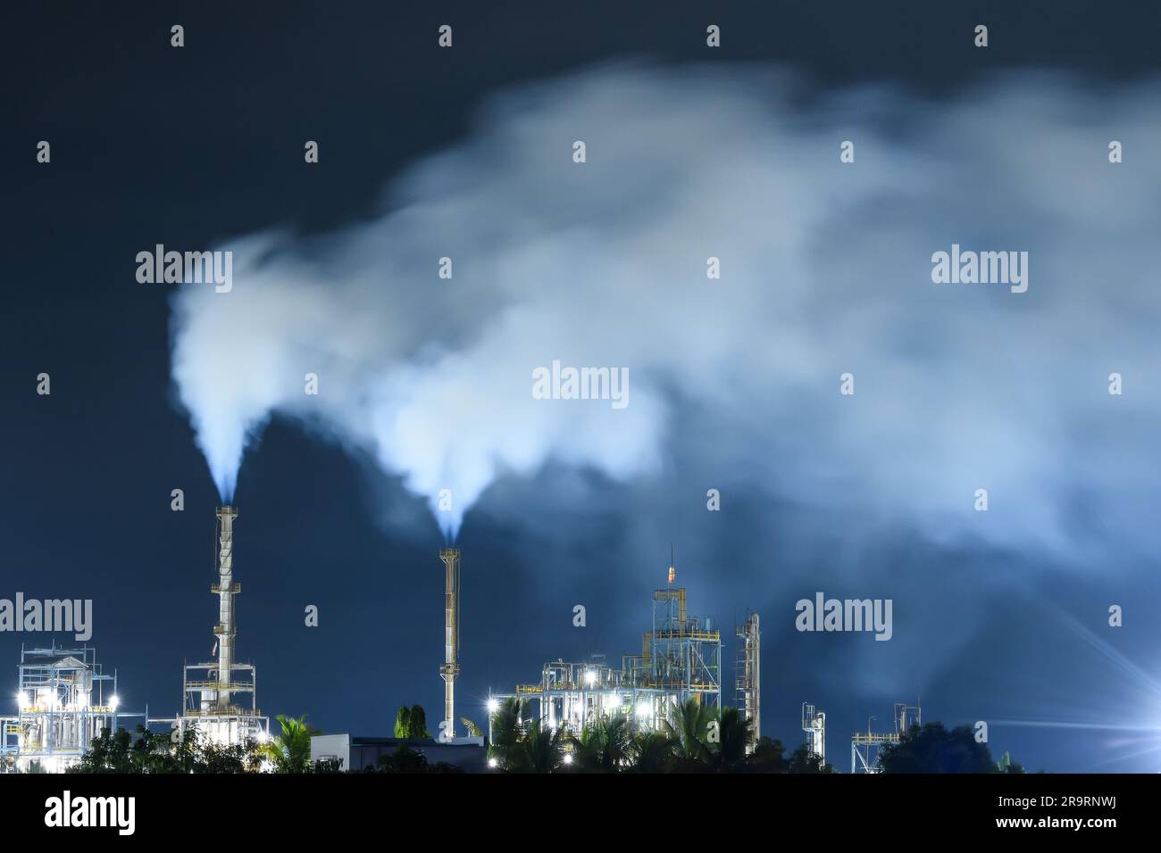 A sugar factory releasing smoke and causing air pollution Stock Photo ...