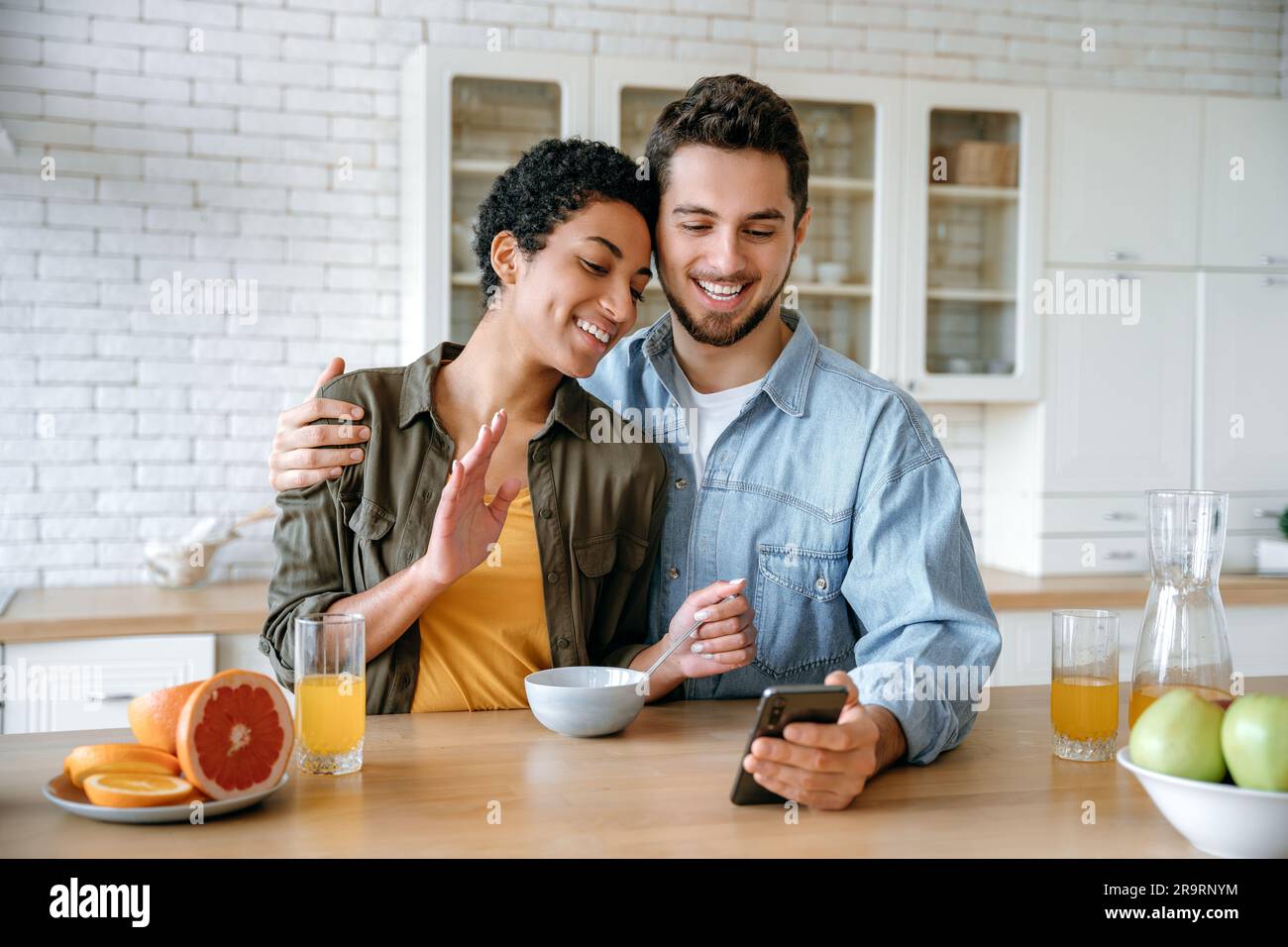 Online video call. Cheerful loving couple of different nationalities ...