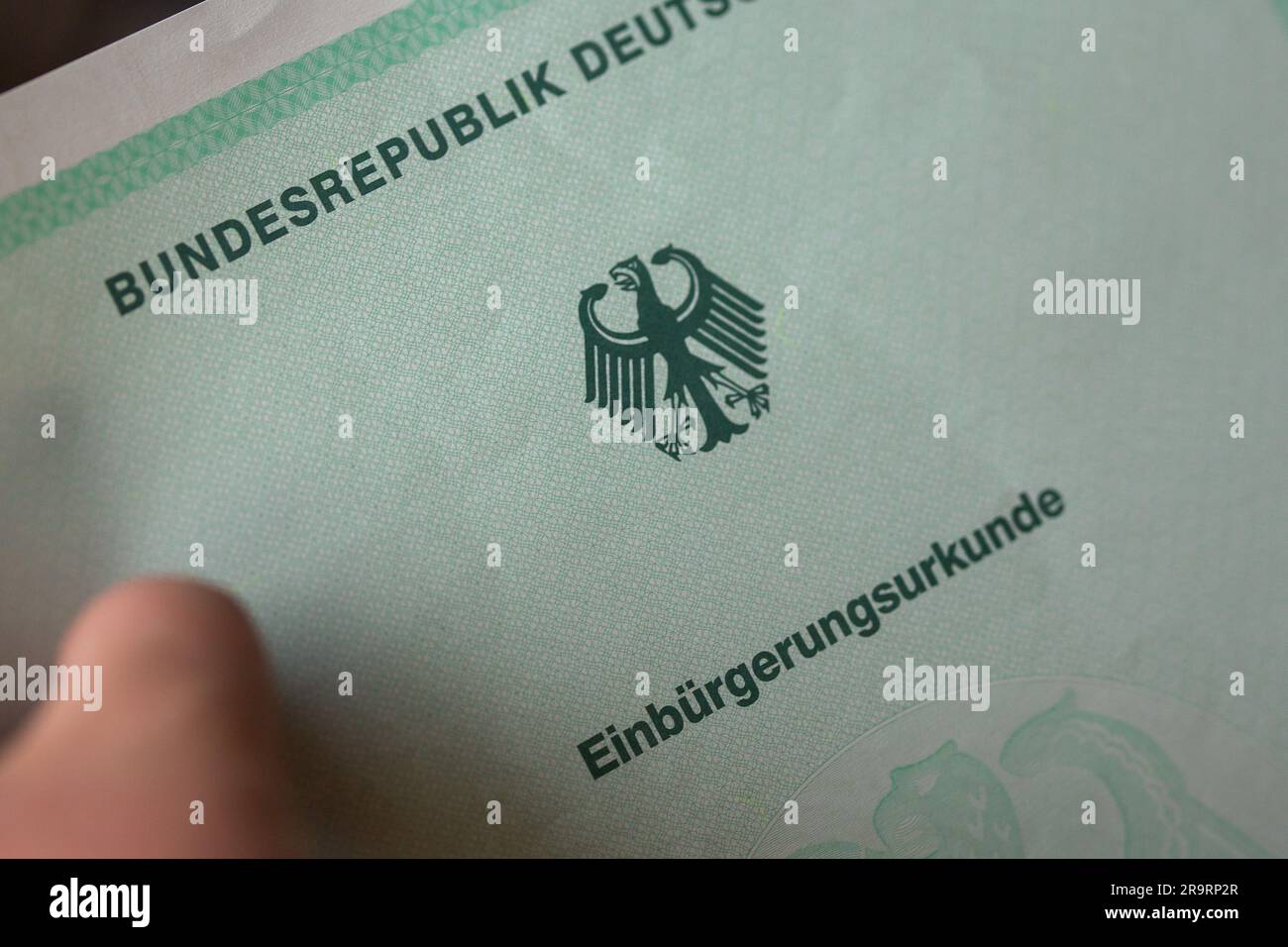 Berlin, Germany. 22nd May, 2023. A person holds a certificate of ...