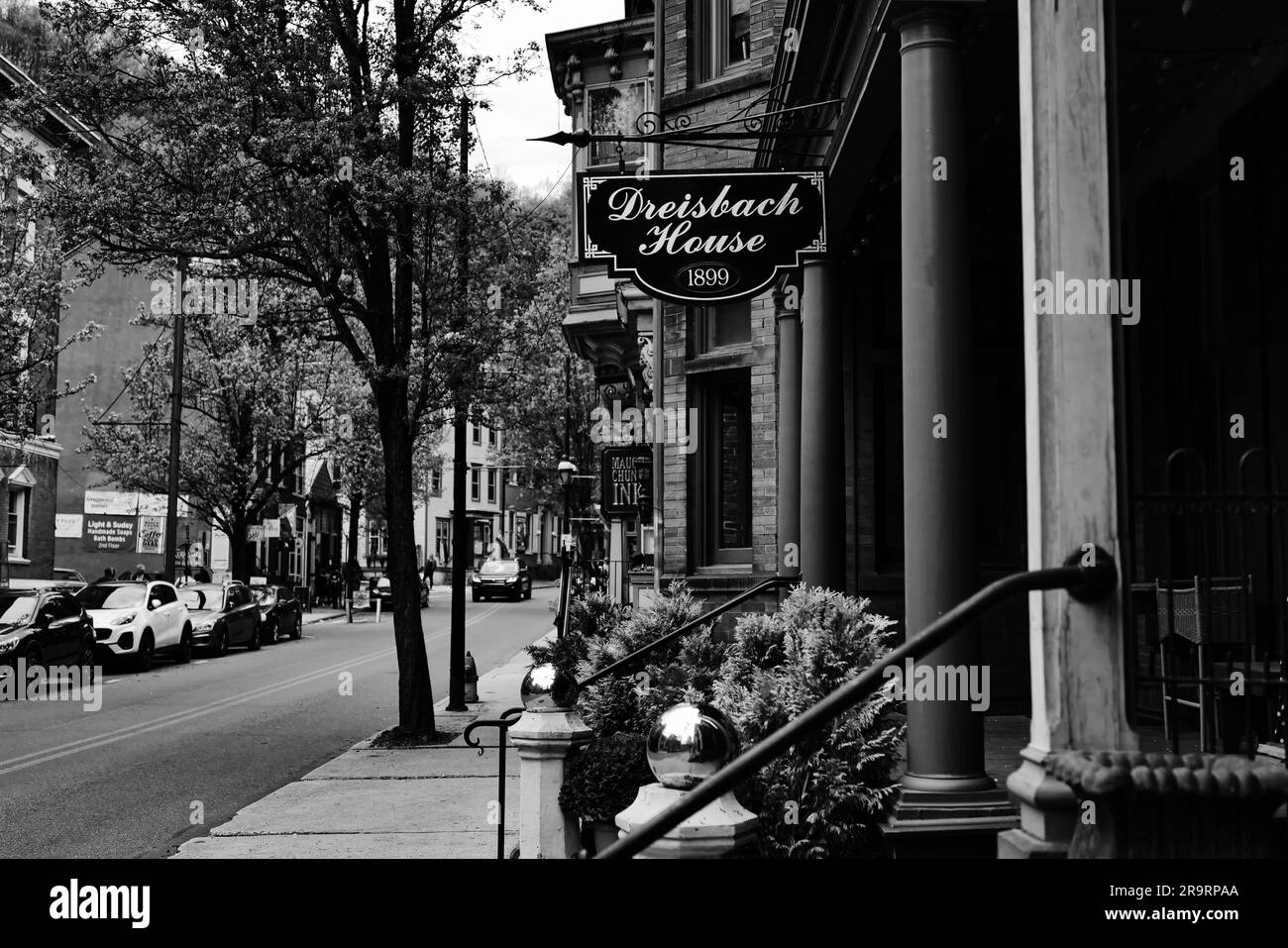 A black and white photograph of the entrance to a quaint restaurant ...