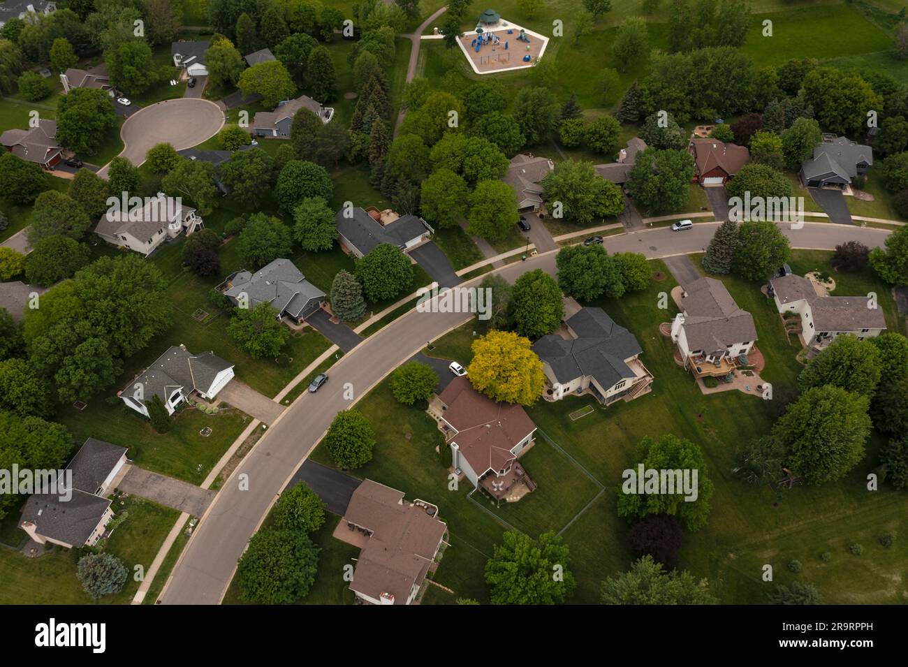 Road Curves Through Neighborhood Cul-de-Sac in Upper Left Stock Photo ...