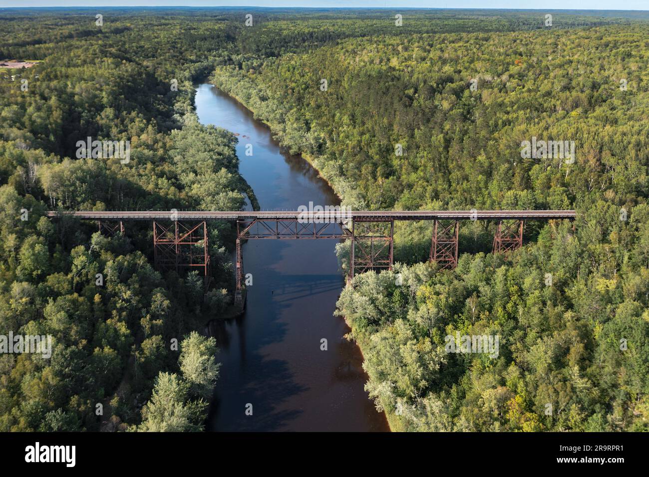 Overhead Railroad Trestle Bridge Over River and Forest - drone aerial ...