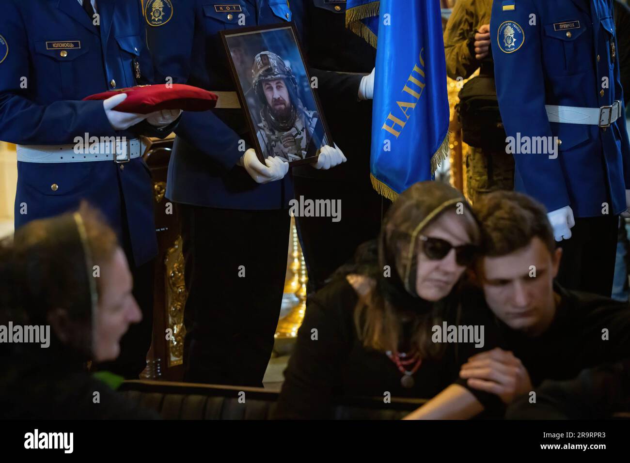 (EDITORS NOTE: Image depicts death) Relatives mourn near the coffin ...