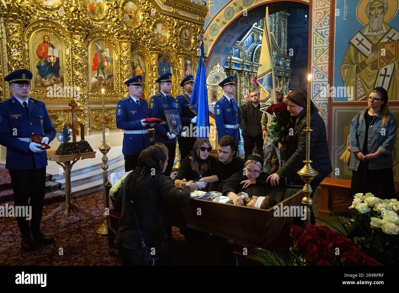 (EDITORS NOTE: Image depicts death) Relatives mourn near the coffin ...