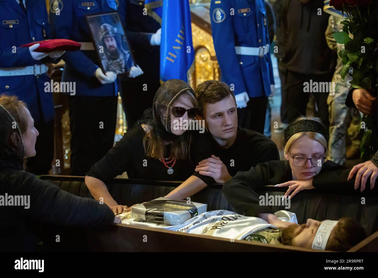 (EDITORS NOTE: Image depicts death) Relatives mourn near the coffin ...
