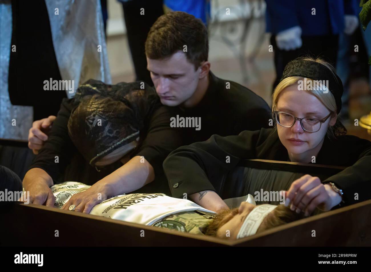 (EDITORS NOTE: Image depicts death) Relatives mourn near the coffin ...