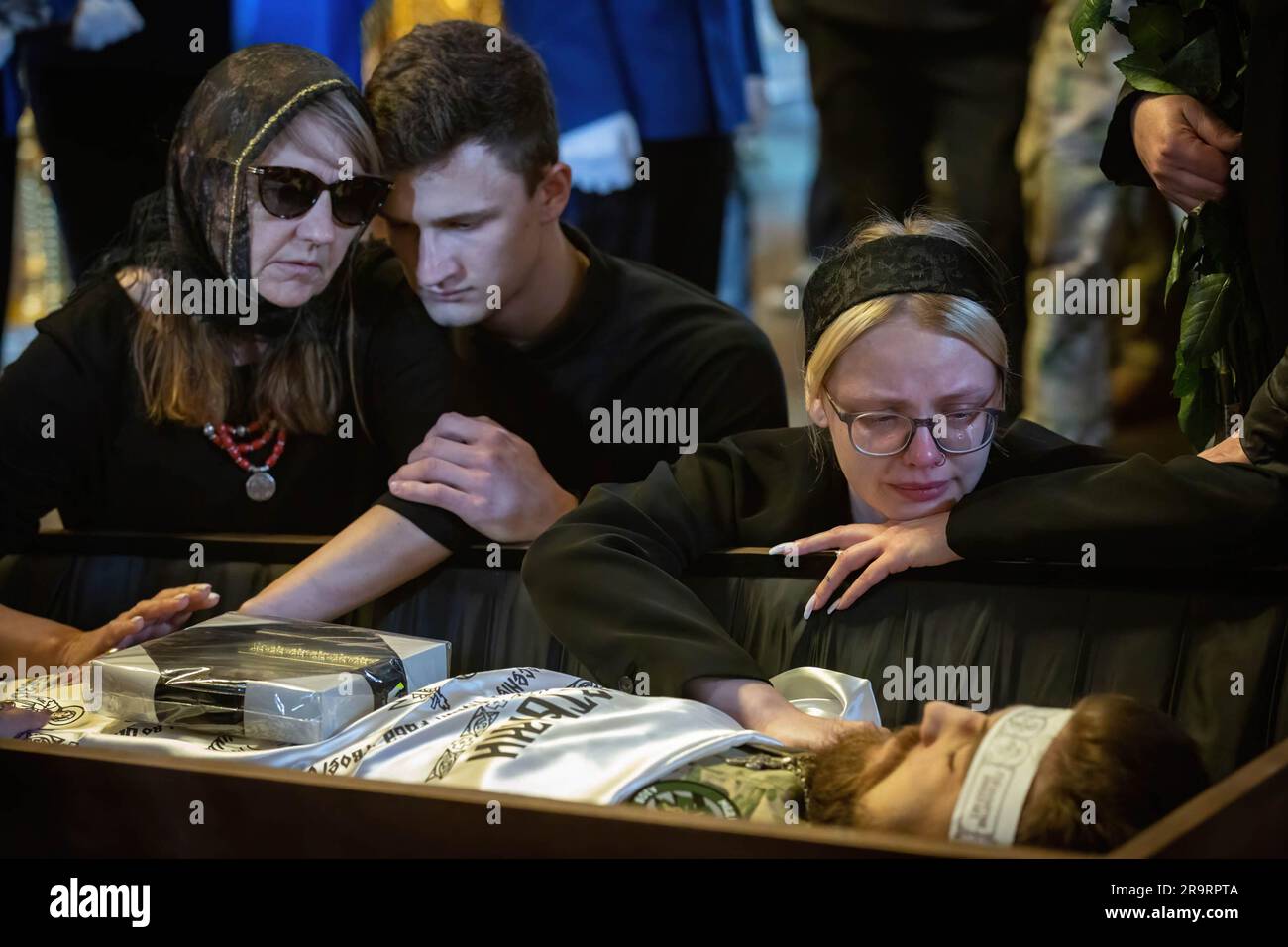 (EDITORS NOTE: Image depicts death) Relatives mourn near the coffin ...