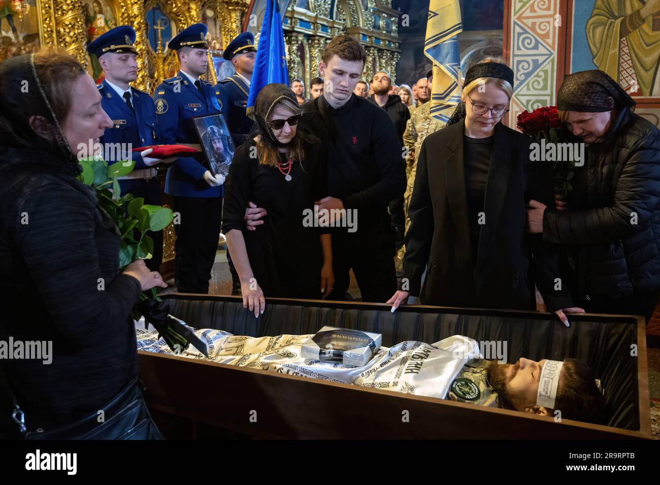 (EDITORS NOTE: Image depicts death) Relatives mourn near the coffin ...
