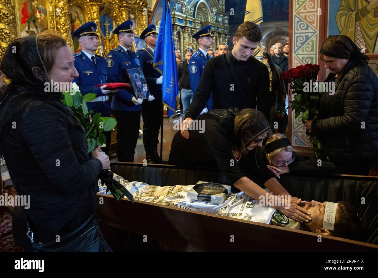 (EDITORS NOTE: Image depicts death) Relatives mourn near the coffin ...
