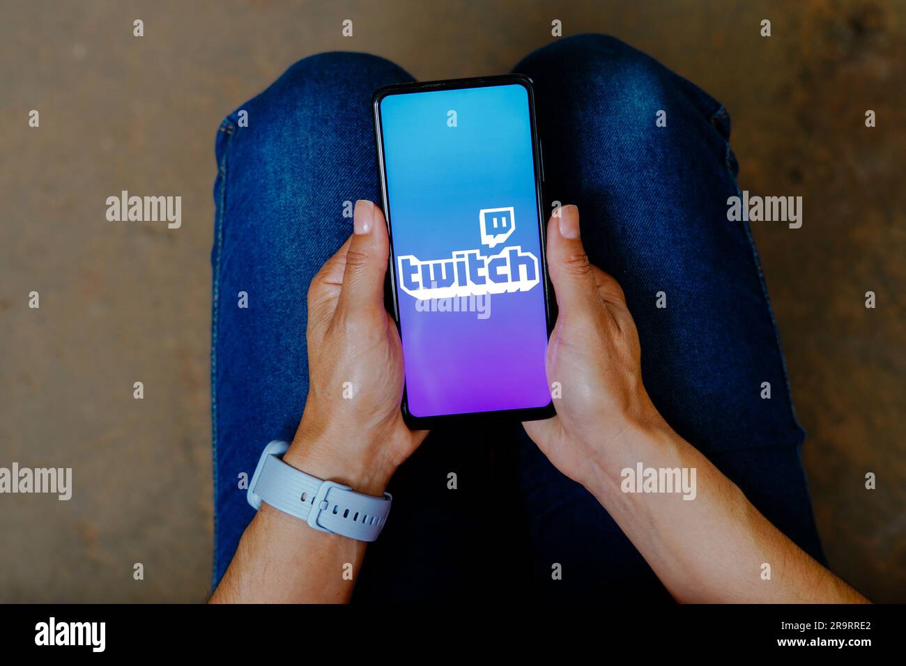 In this photo illustration, the Twitch logo is displayed on a ...