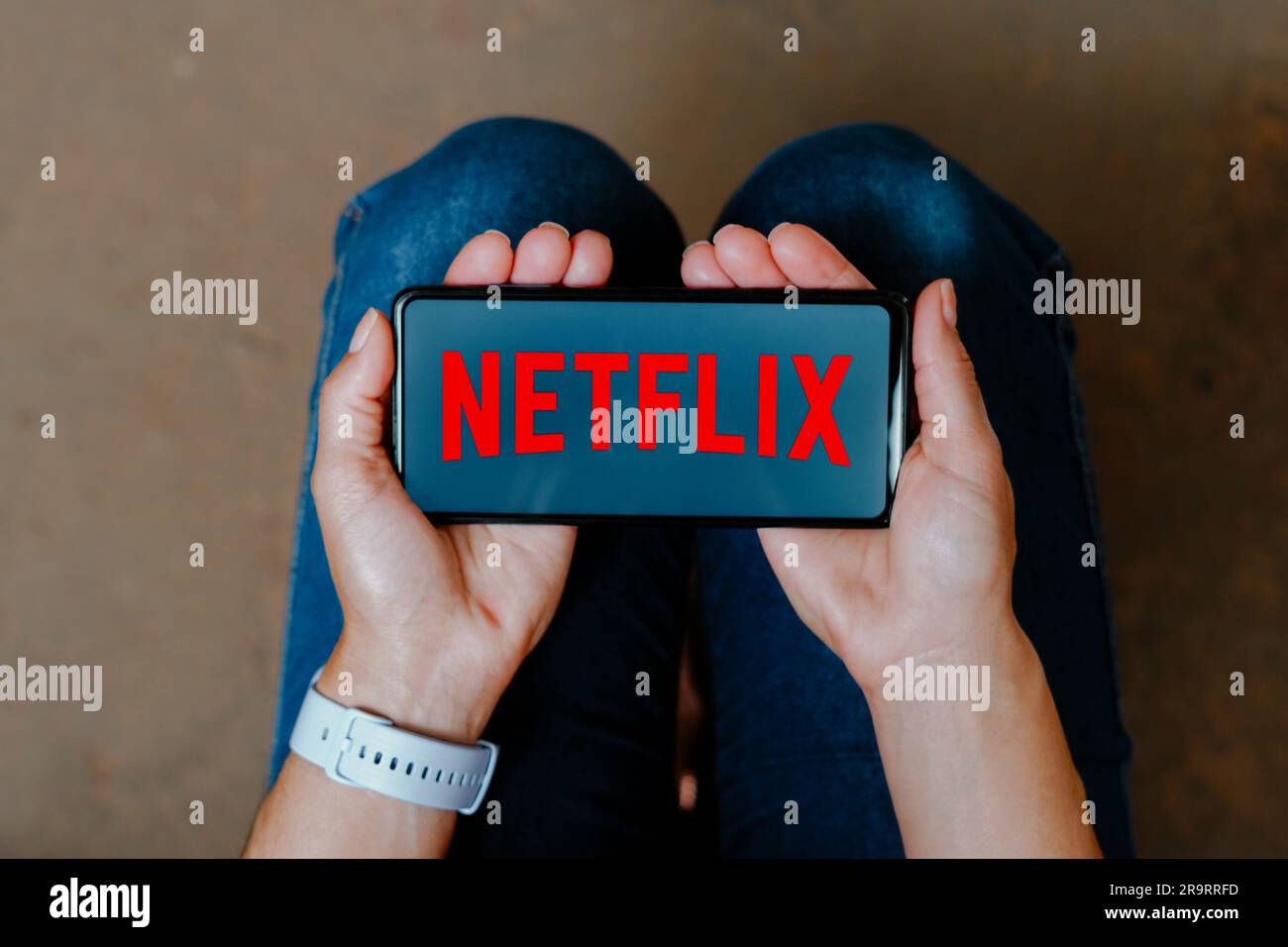 In this photo illustration, the Netflix logo is displayed on a ...