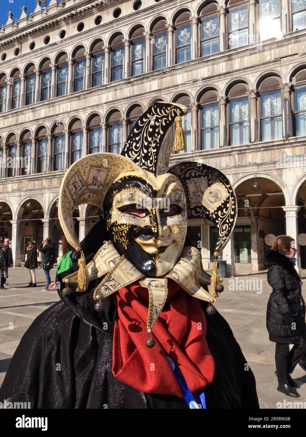 A young adult in wearing a black and red festive costume during the ...