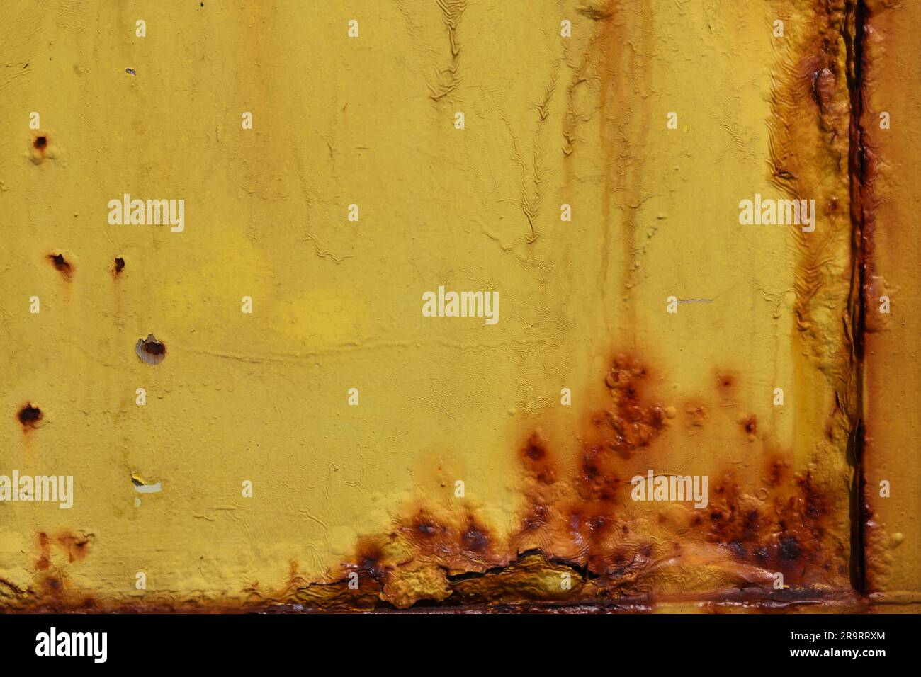 Scuffed and rusting old yellow metal background with copy space Stock ...