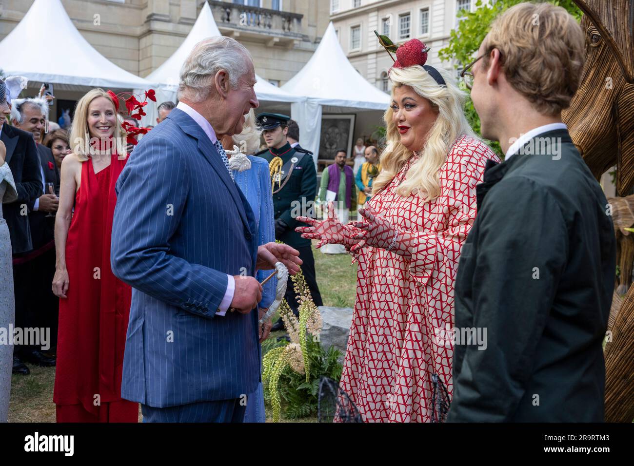 King Charles III speaks to Gemma Collins as he attends the Animal Ball ...