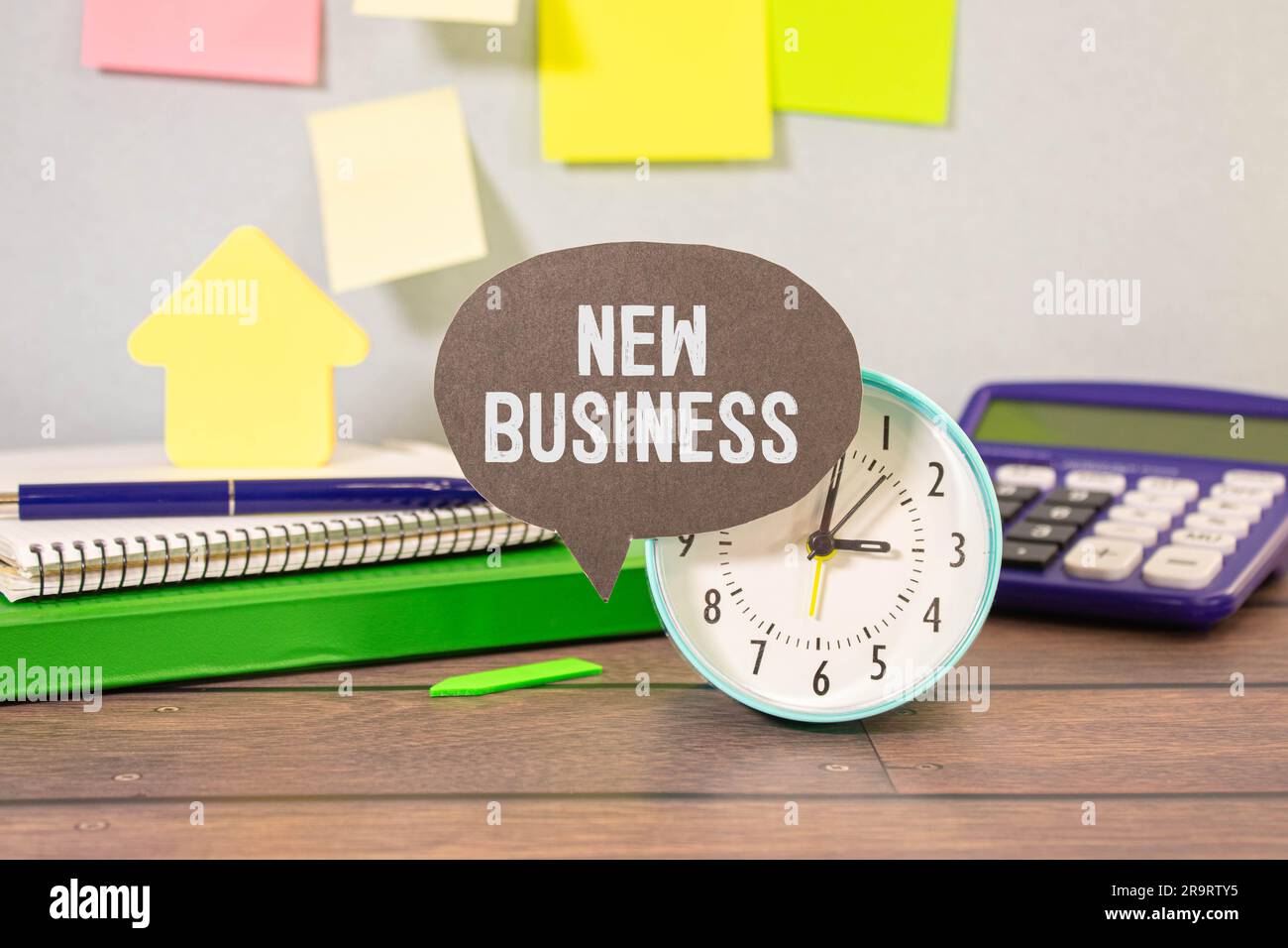 Business concept. On the business charts are a pen and stickers with ...