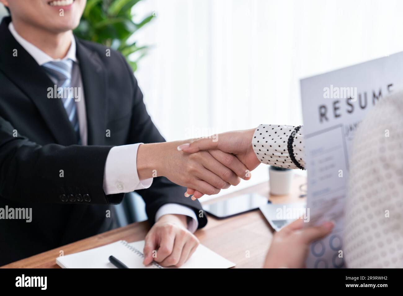 Happy business people shake hands after successful meeting or job ...