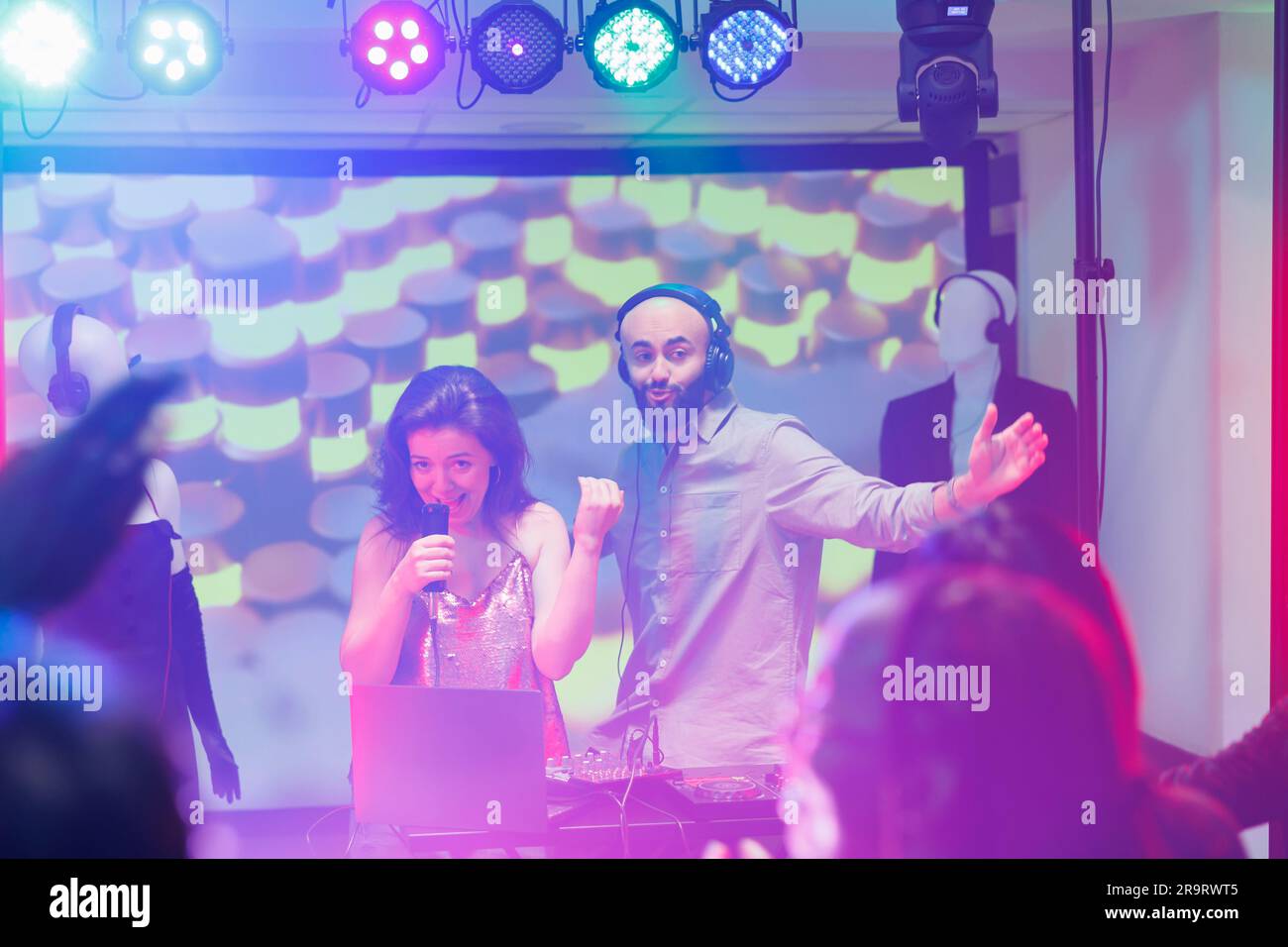 Woman speaking on stage in spotlight hi-res stock photography and ...