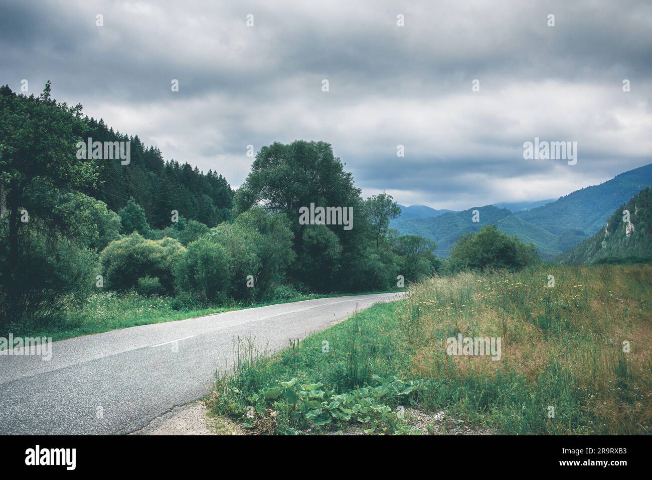 Country road crossing beautiful countryside Stock Photo - Alamy