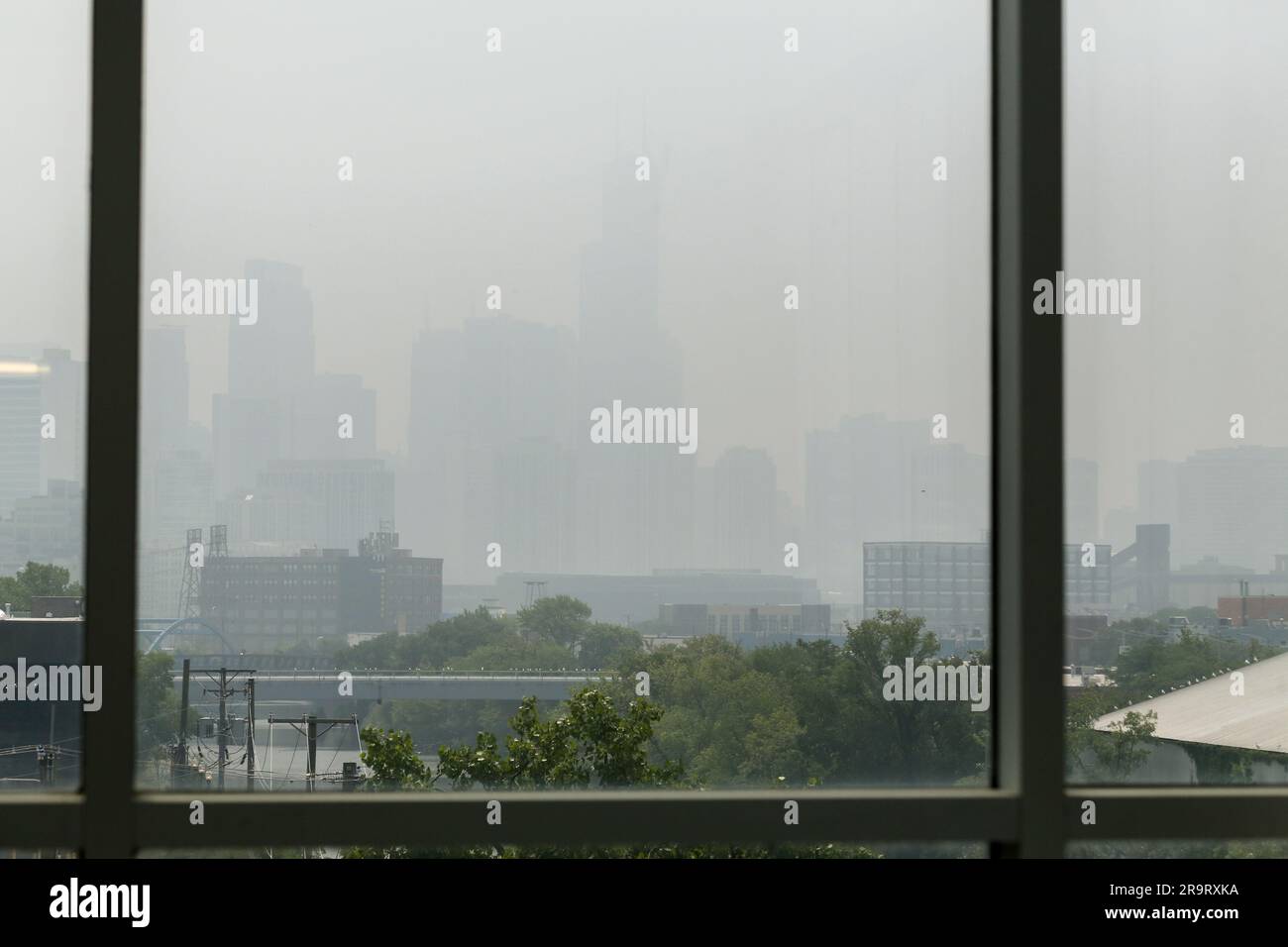 The downtown skyline and the iconic Willis Tower are obscured by heavy ...