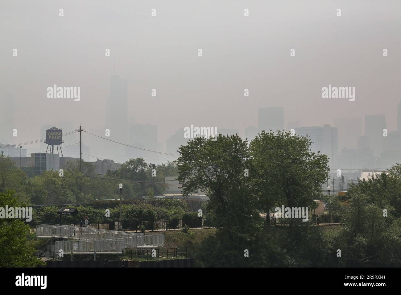 The downtown skyline and the iconic Willis Tower are obscured by heavy ...