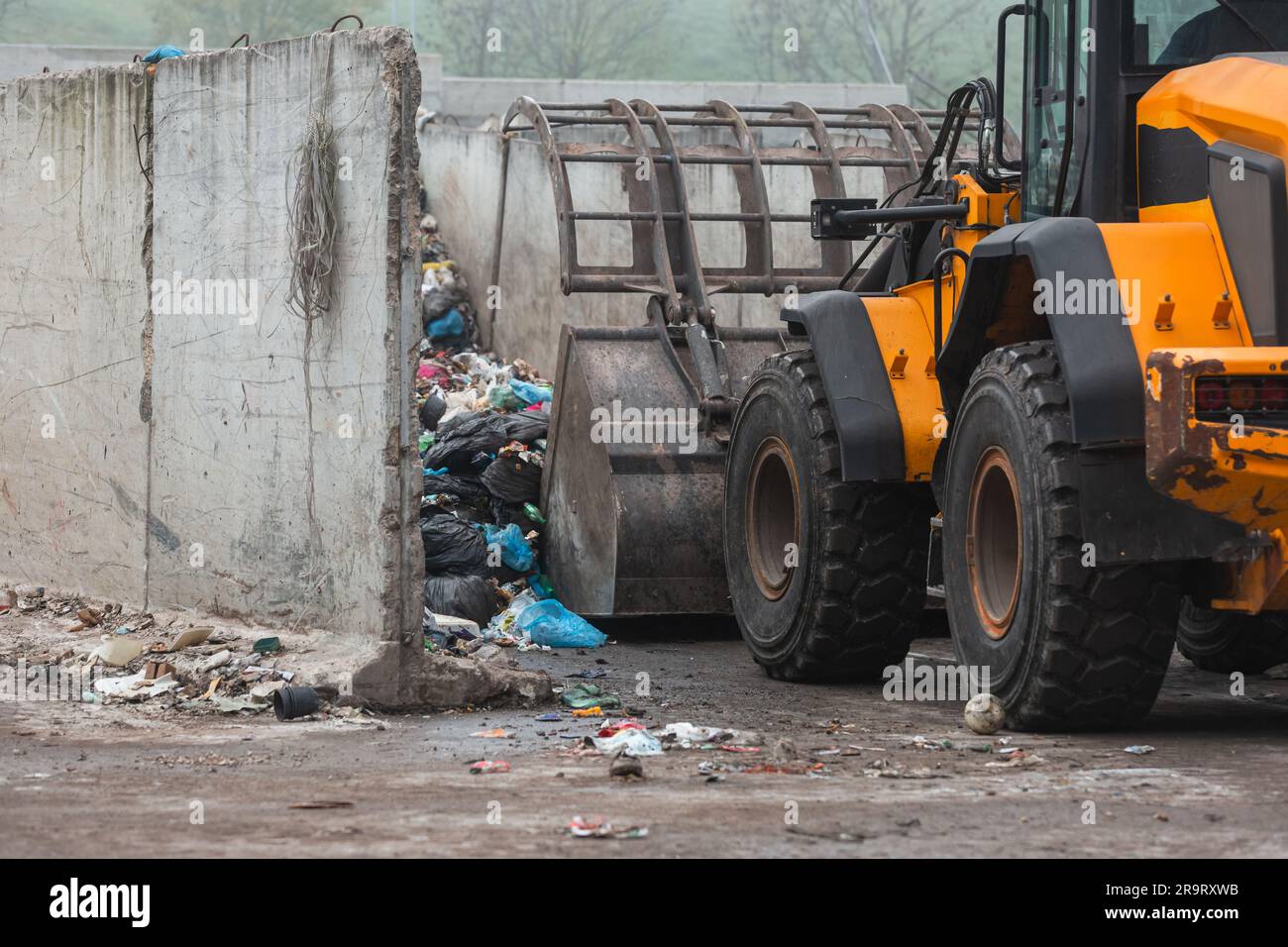 Heavy construction machine, front end loader moving along recycling ...