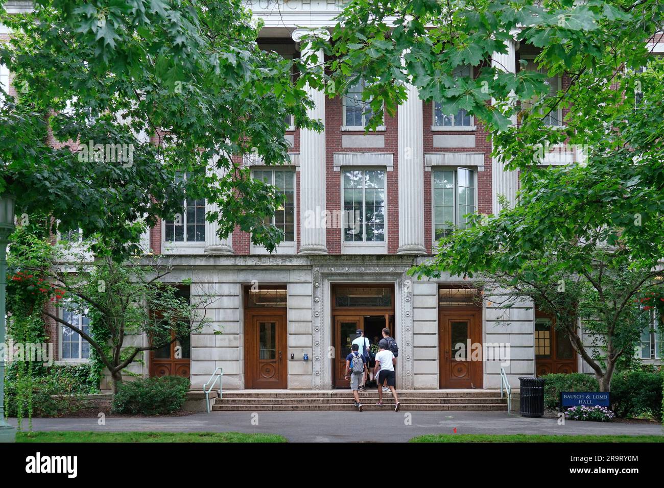 Students entering a building on the campus of the University of ...