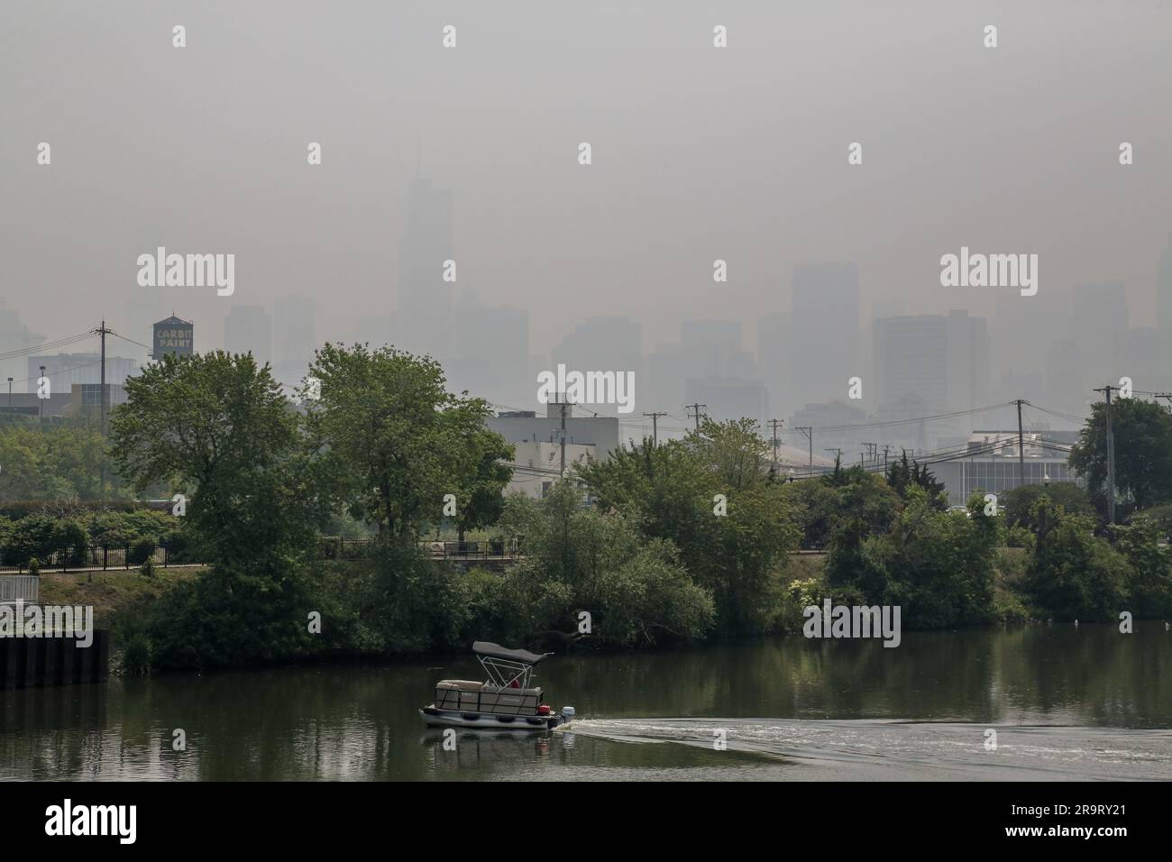The downtown skyline and the iconic Willis Tower are obscured by heavy ...