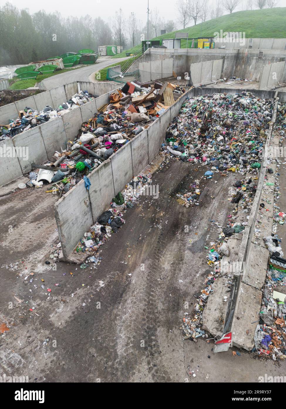 Landfill site, a pile of stinky different junk disposal in the concrete ...