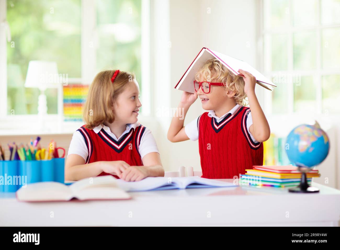 Kids go back to school. Children study and learn for preschool. Boy and ...