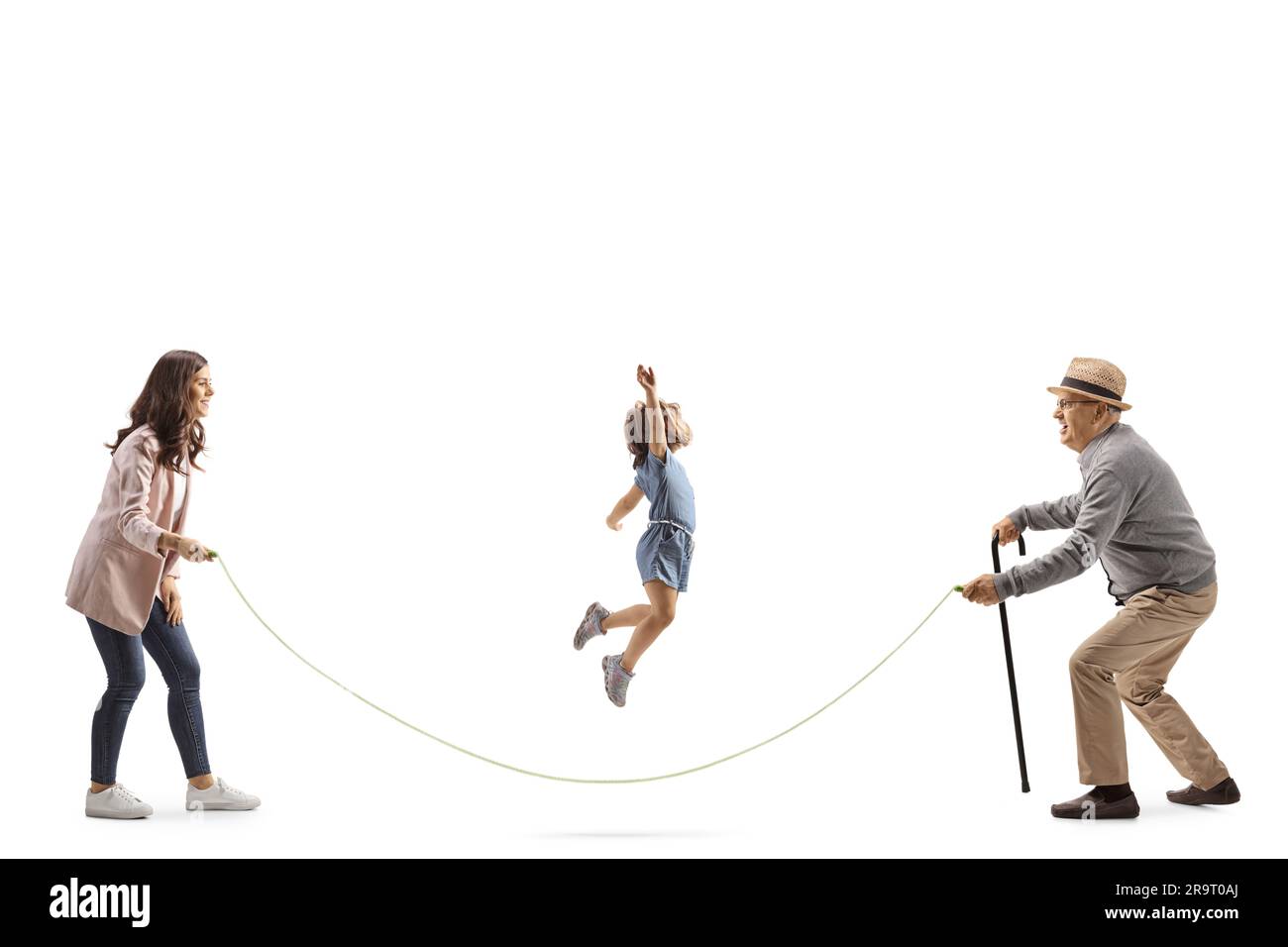 Mother, daughter and grandfather playing skipping rope isolated on ...