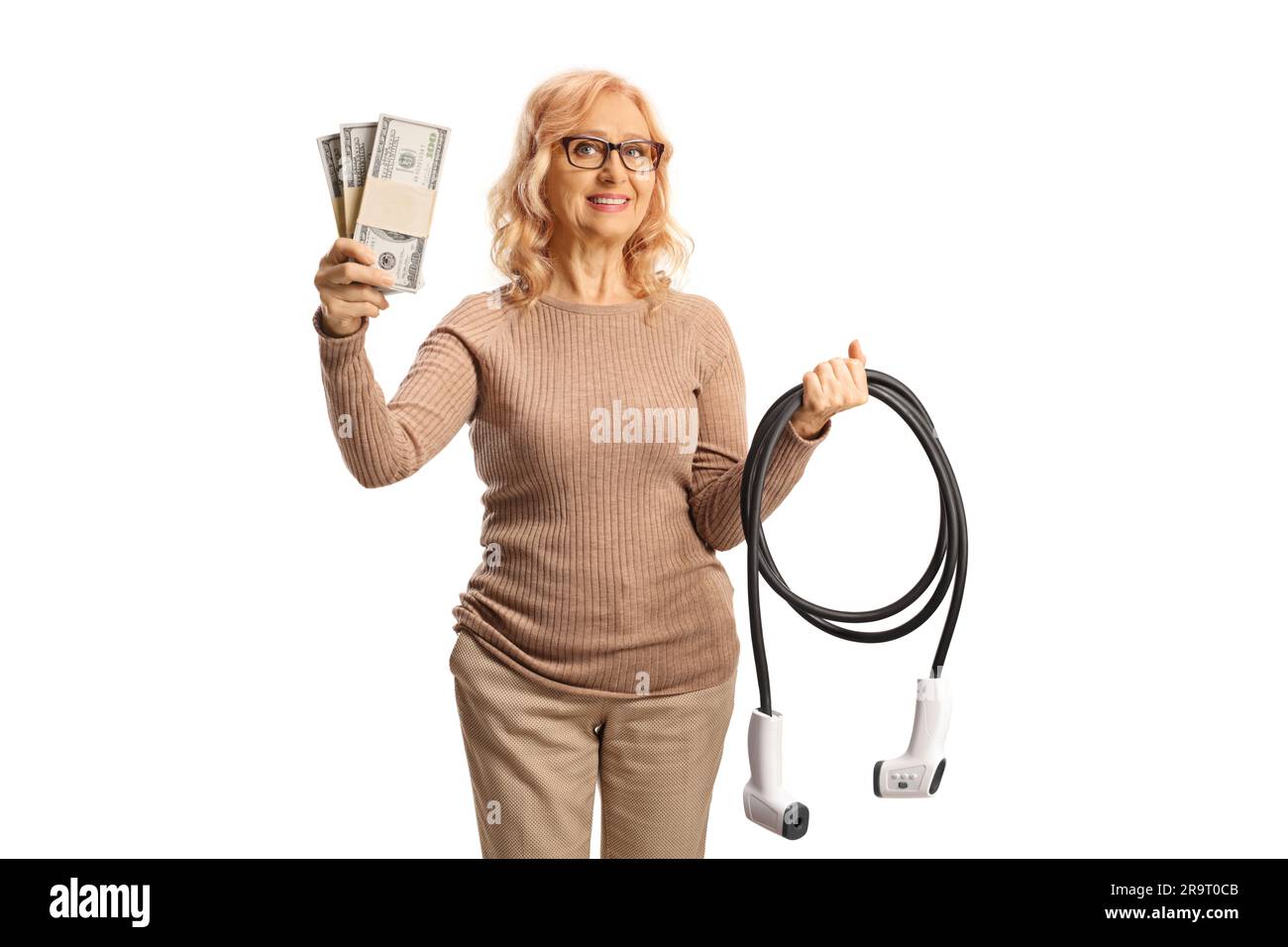 Woman holding money and cables for EV charging isolated on white ...