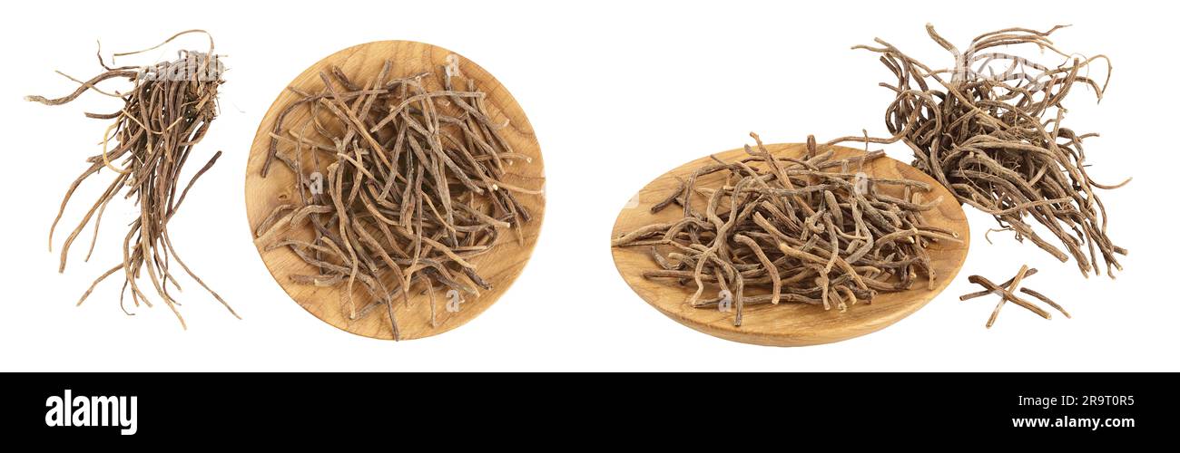 Dried Valerian root in wooden bowl isolated on white background ...