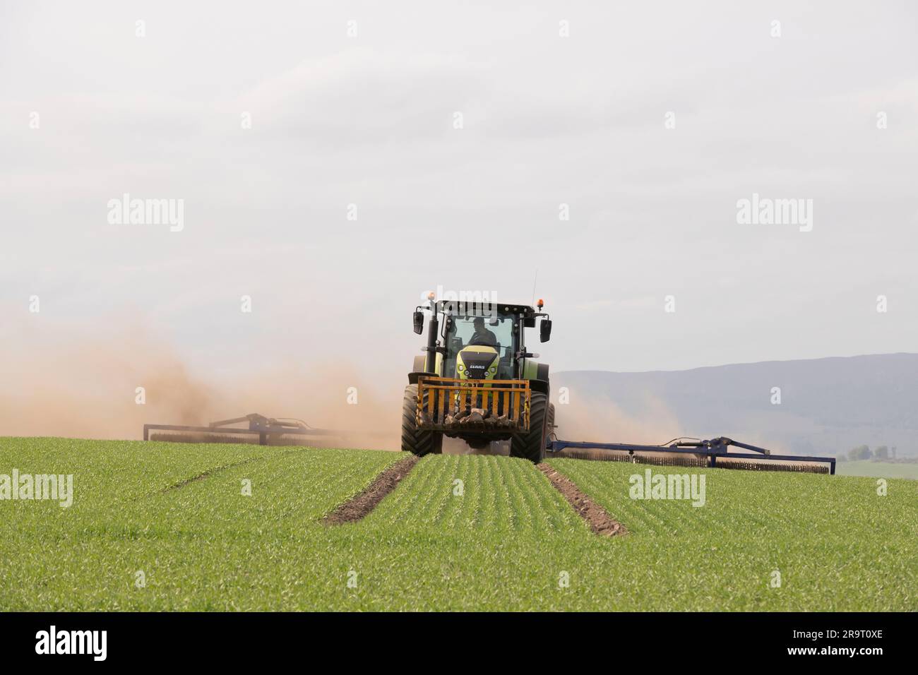 A Claas Tractor and Dalbo Powerroll 1530 Creating Clouds of Dust ...
