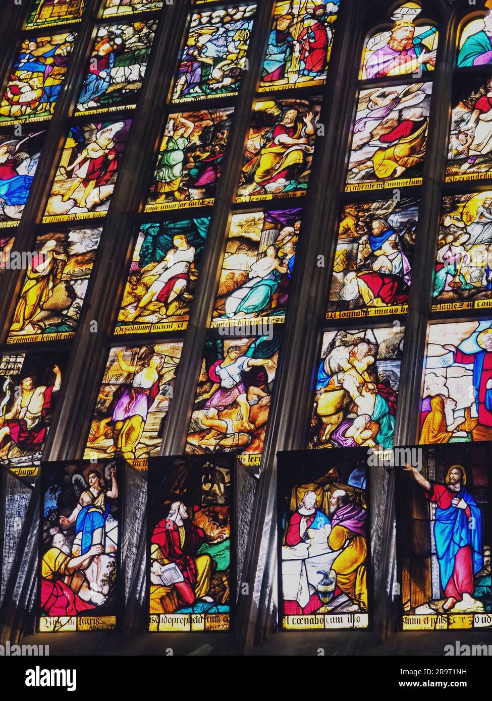 A colorful stained glass window in the Duomo di Milano, the iconic ...