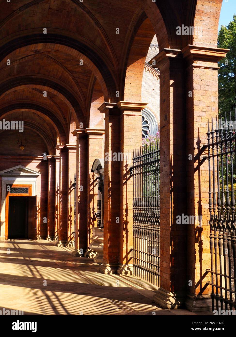 An aerial view of an expansive pathway lined with majestic arches and ...