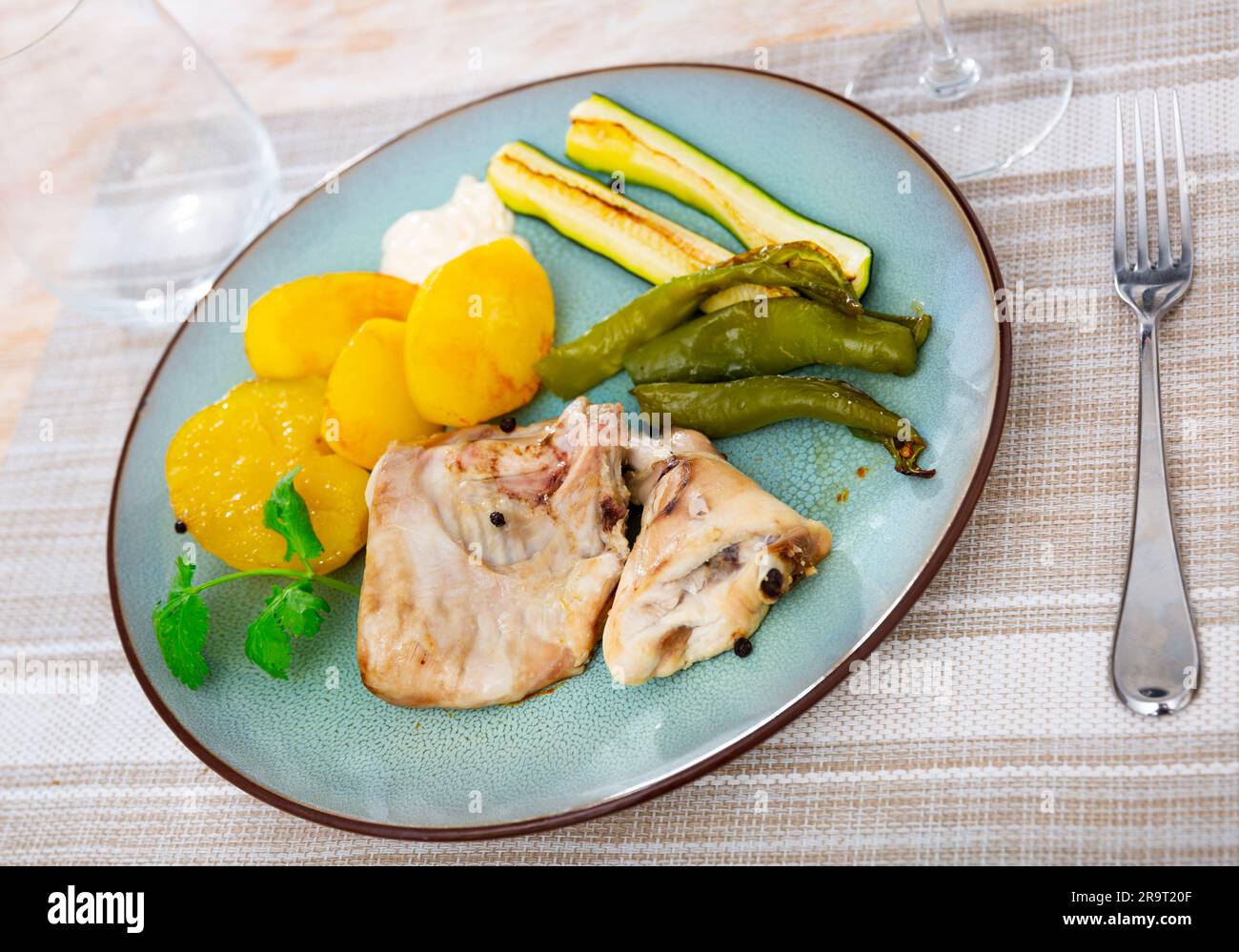 Roasted rabbit served with vegetable garnish Stock Photo - Alamy