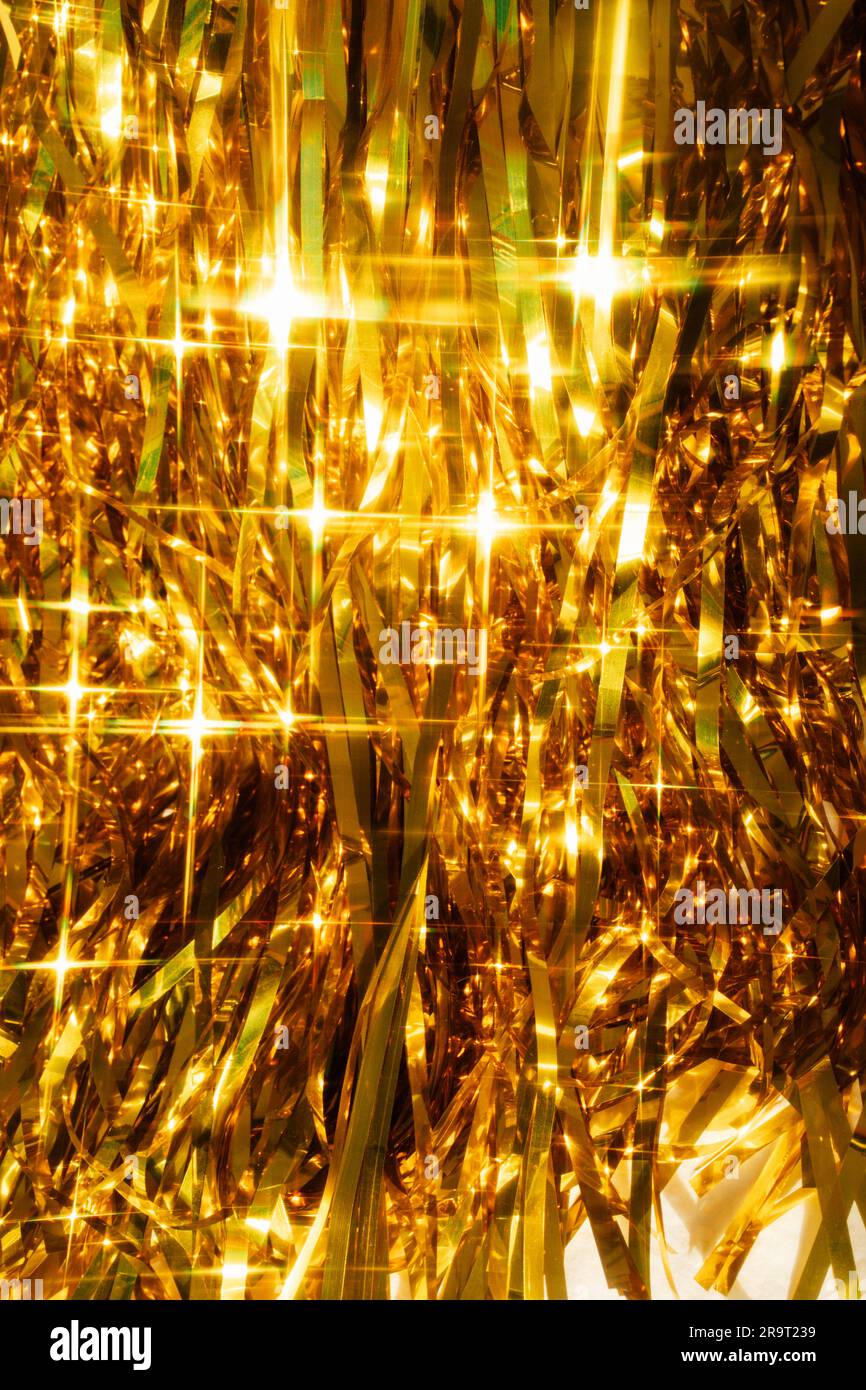 sparkling, glittering golden tinsel party background Stock Photo - Alamy