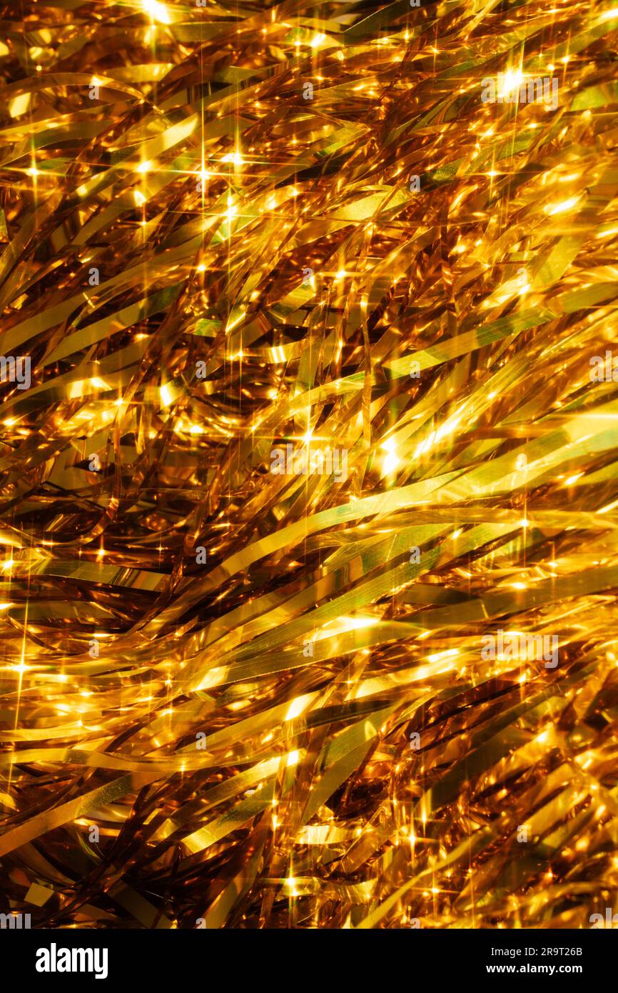 sparkling, glittering golden tinsel party background Stock Photo - Alamy