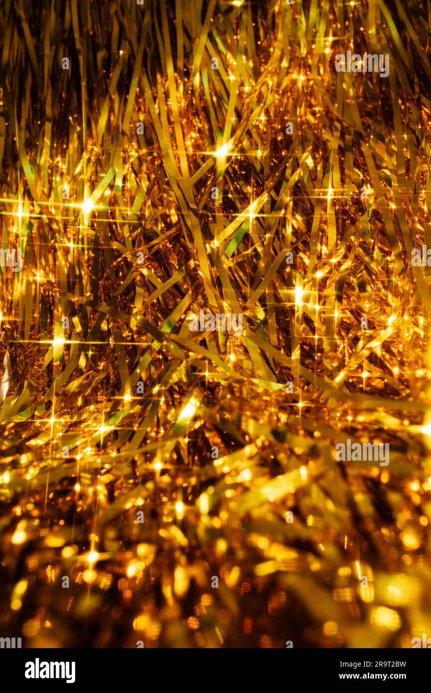 sparkling, glittering golden tinsel party background Stock Photo - Alamy