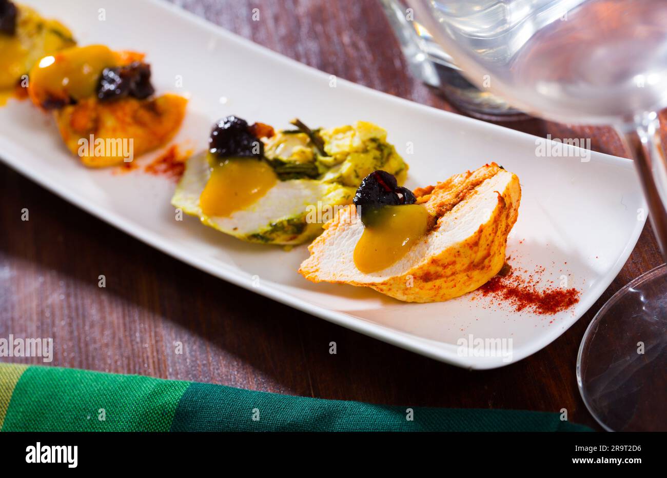 Turkey breast on spicy sauce mango served with with paprika and prunes ...