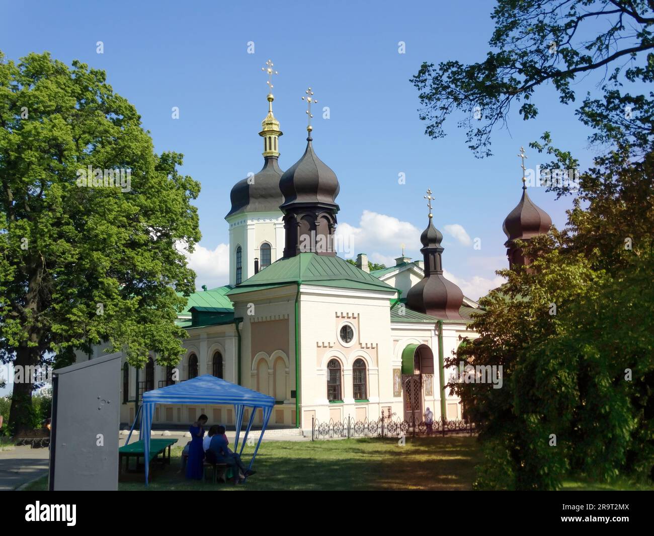 Black domes of the white church with crosses on the blue sky. Holy ...