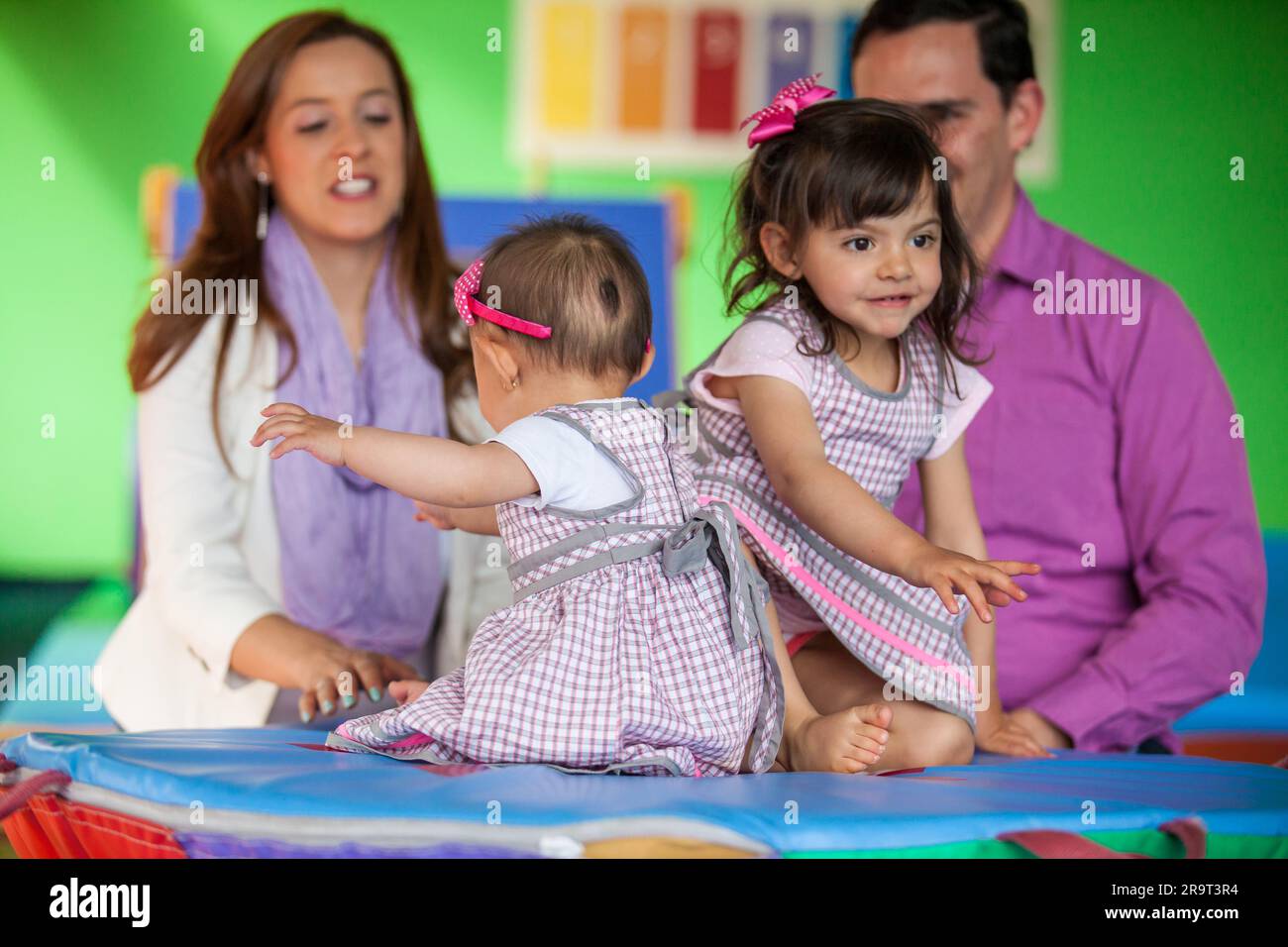 Beautiful ten months baby girl playing with her sister and their ...