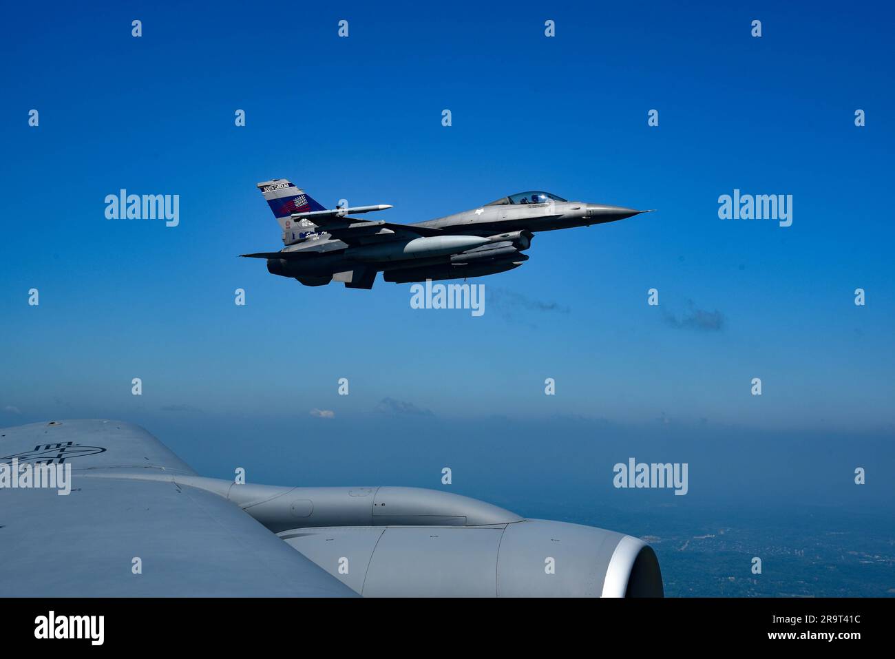 An F-16 from the 169th Fighter Wing in South Carolina escorts a KC-135 ...