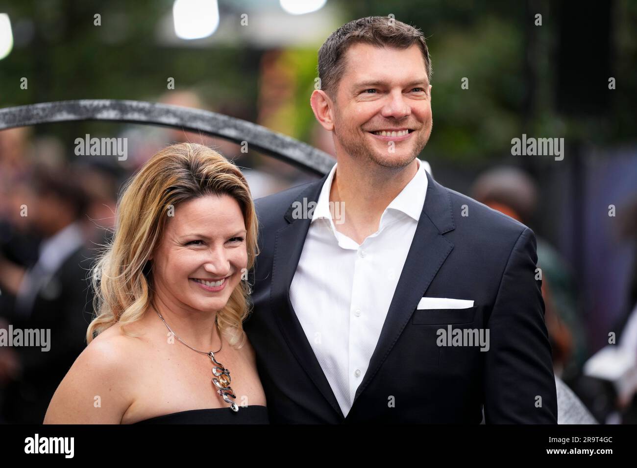 Wolfgang Stegemann, right, and guest pose for photographers upon ...
