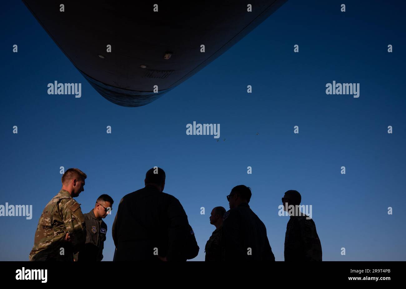 Aircrew assigned to the 6th Air Refueling Wing breif in front of a KC ...